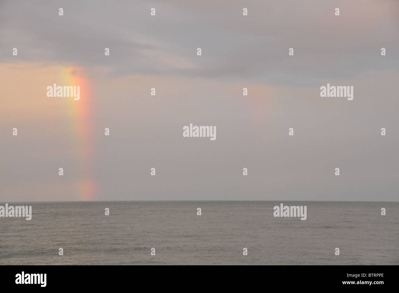 Rainbow over sea Stock Photo - Alamy