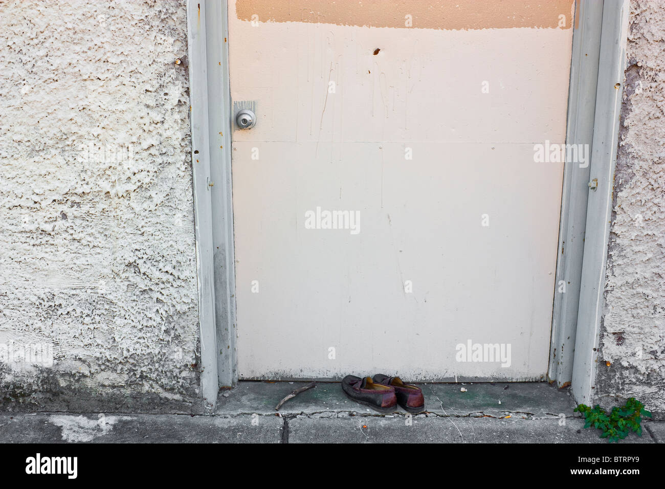 Shoes left by front door Stock Photo - Alamy