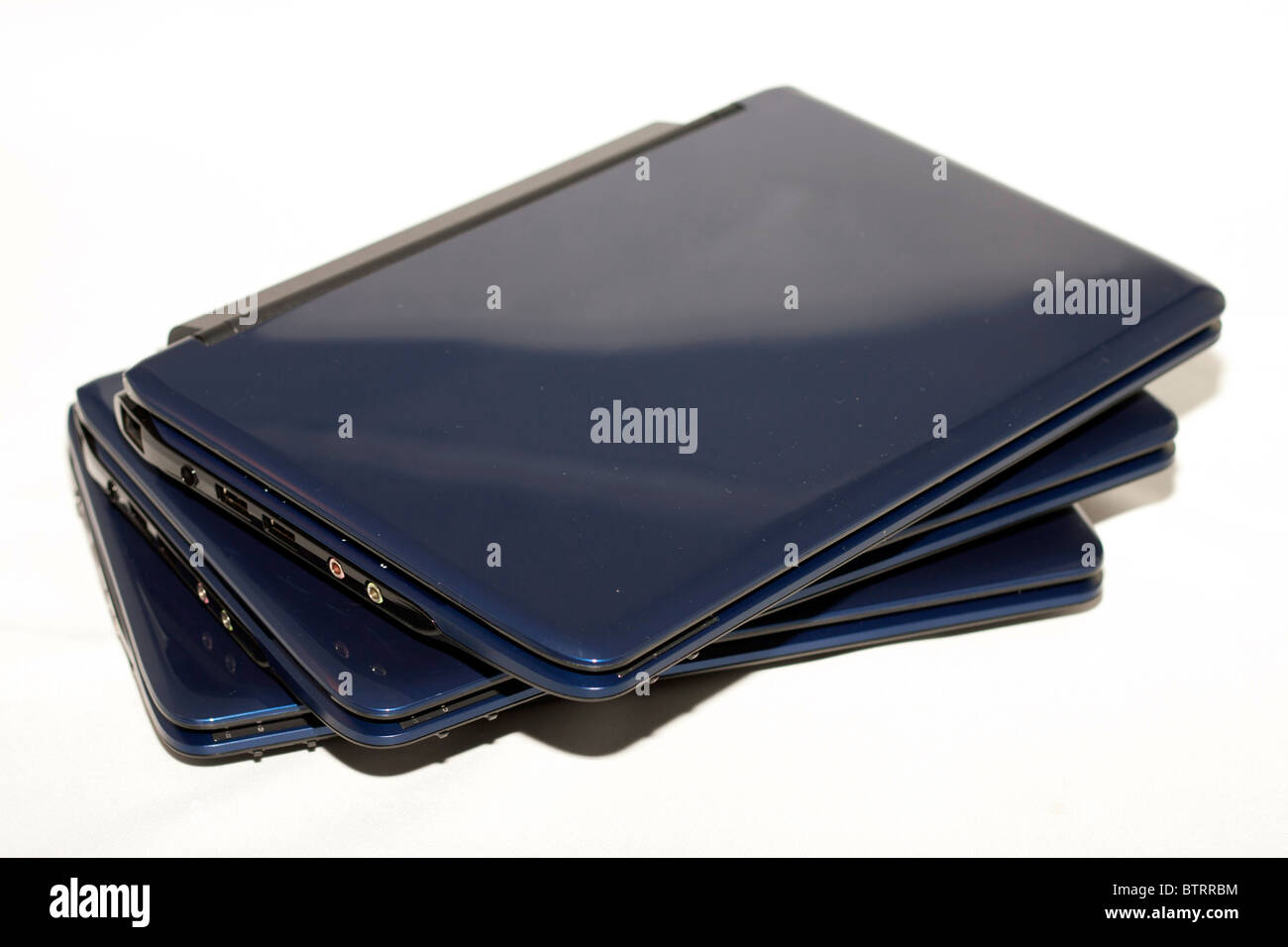 Three small netbook computers isolated on white Stock Photo - Alamy