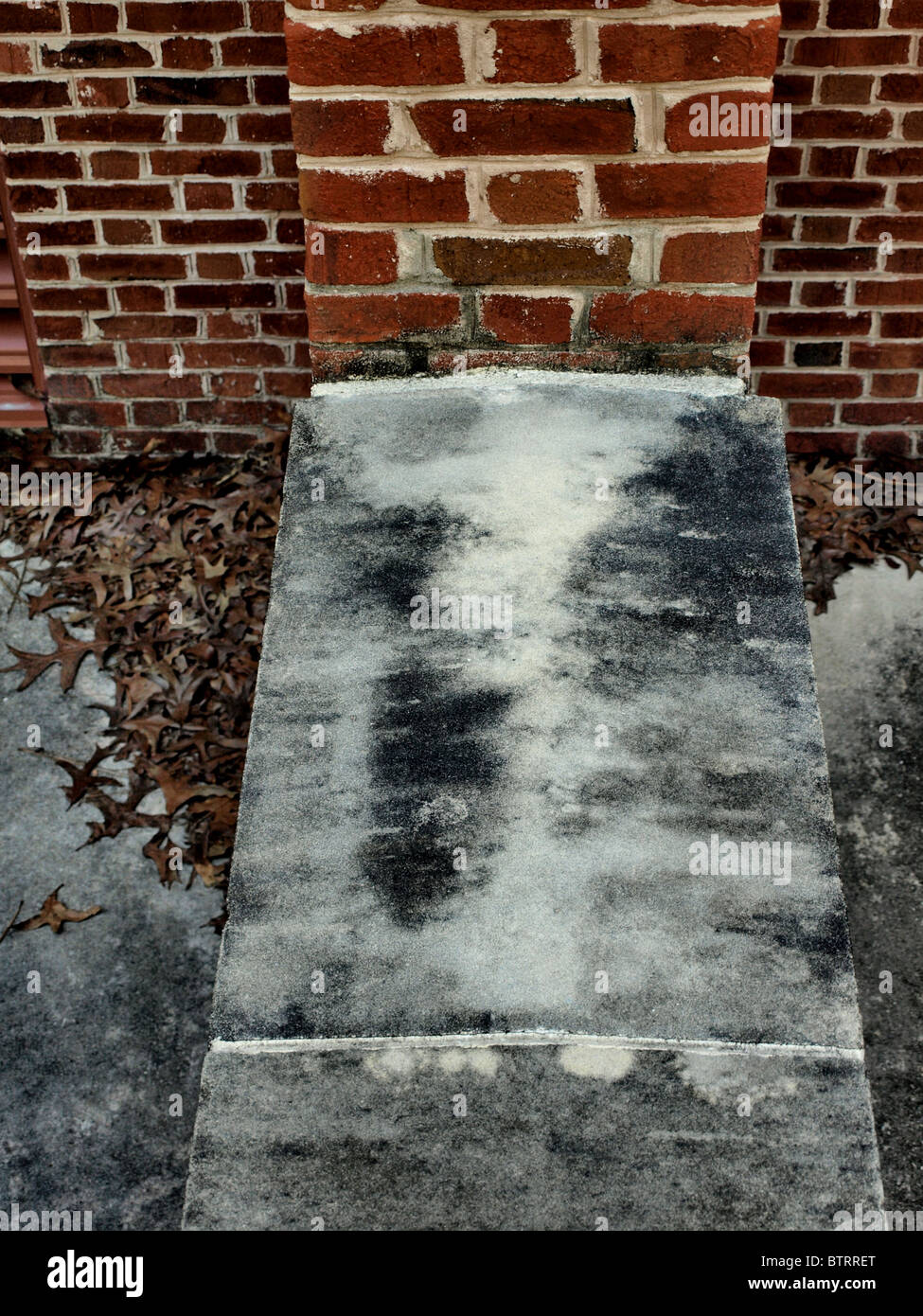 cement cap on wall near brick building bricks stone Stock Photo - Alamy