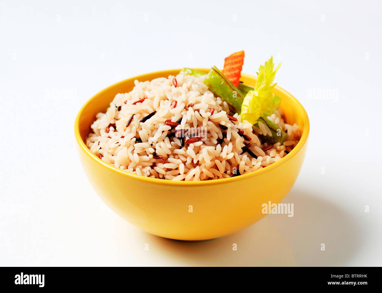 Bowl of cooked mixed rice Stock Photo - Alamy