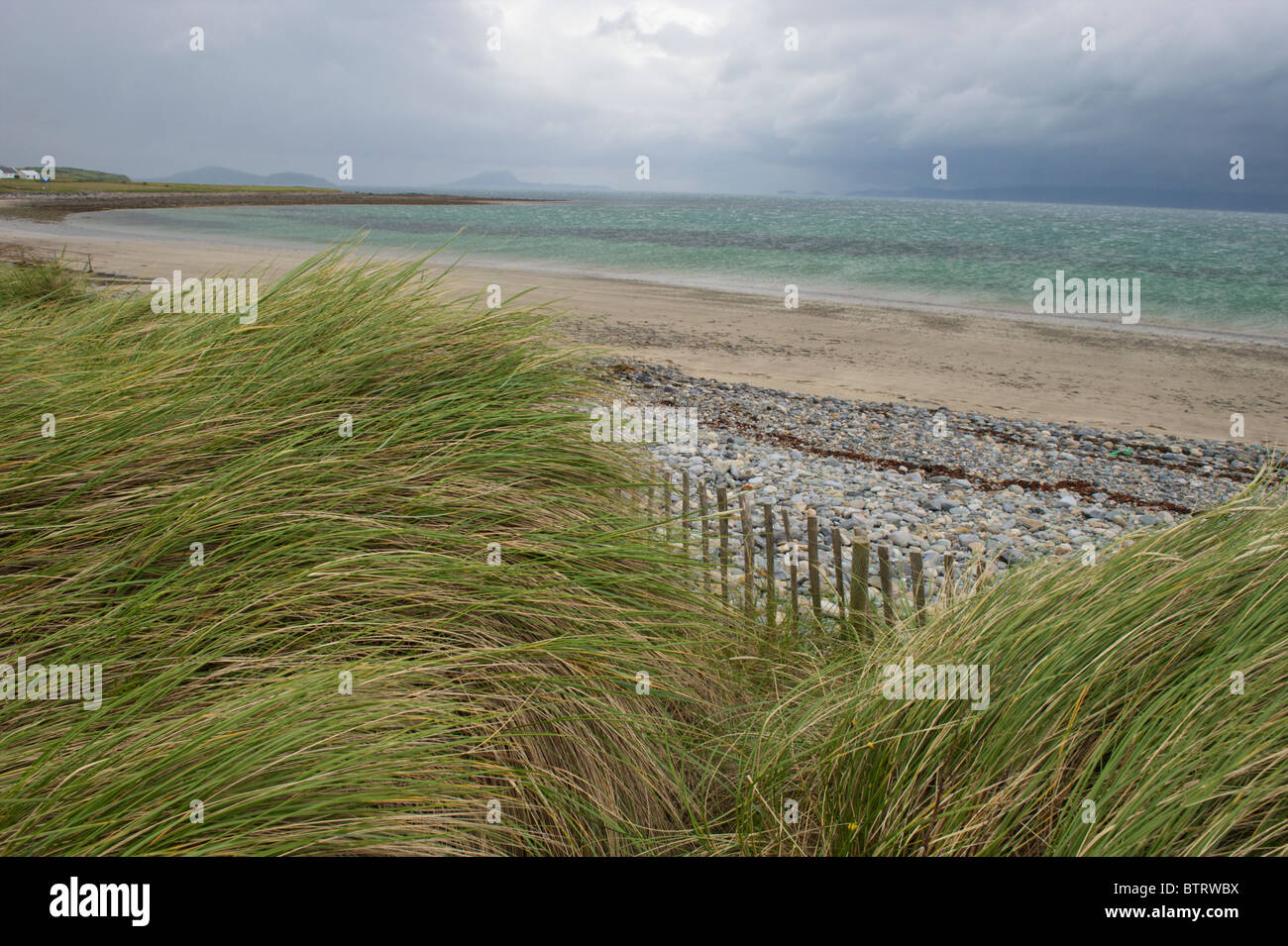 Storm clouds over Bertra beach with a view of Clare Island in the ...