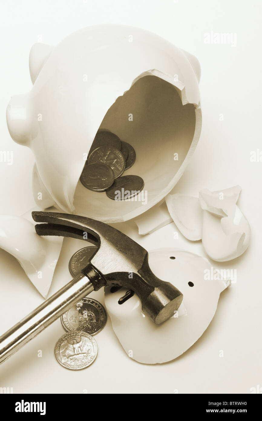 Broken piggy bank coins scattered hi-res stock photography and images ...