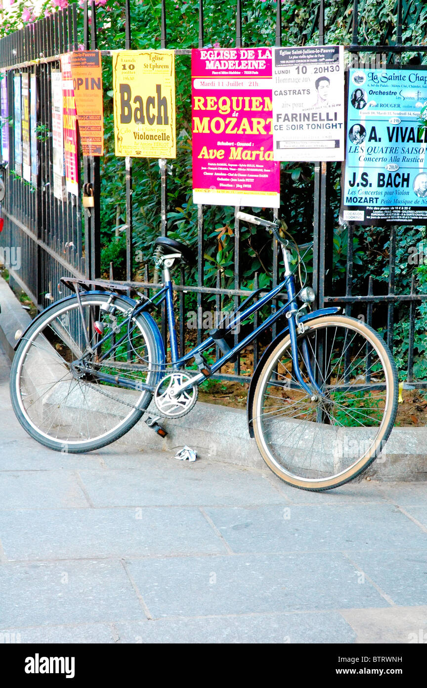 Bicycle parked near Opera posters Stock Photo - Alamy