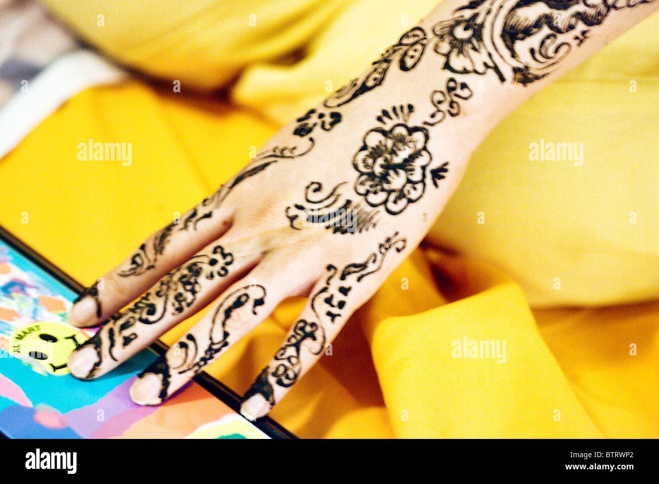 Young Muslim bride-to-be has elaborate henna designs painted on her ...