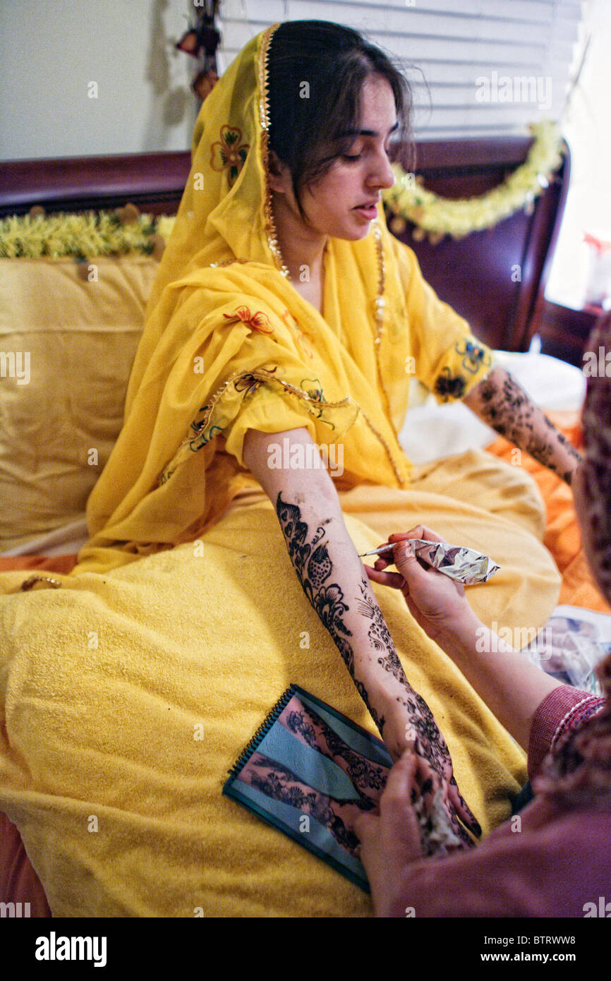 Young Muslim bride-to-be has elaborate henna designs painted on her ...