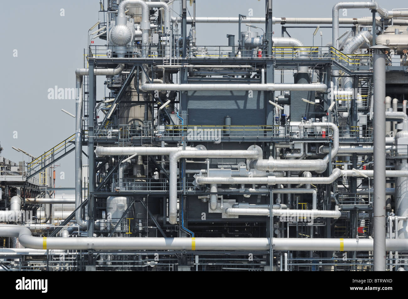 View on an oil refinery in Austria with many pipes going in many ...