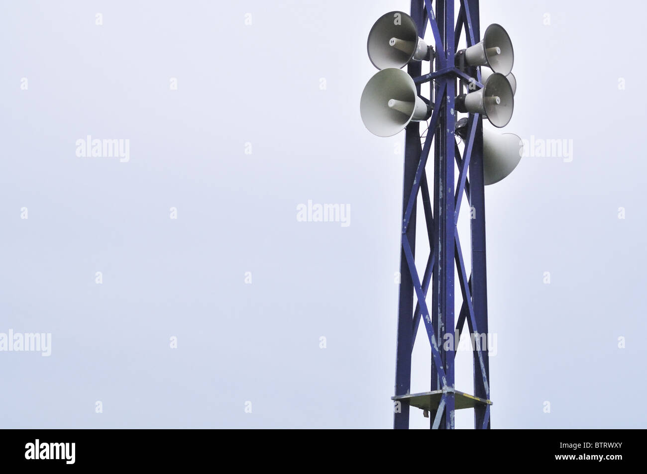 Stack of six megaphones on a pole Stock Photo - Alamy