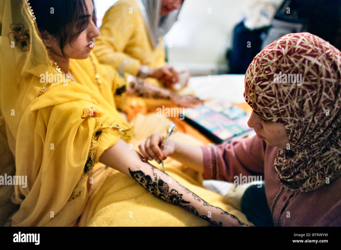 Young Muslim bride-to-be has elaborate henna designs painted on her ...