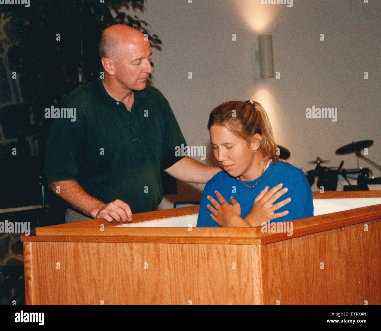 Young woman being baptized at church in Riverdale Park, Md Stock Photo ...