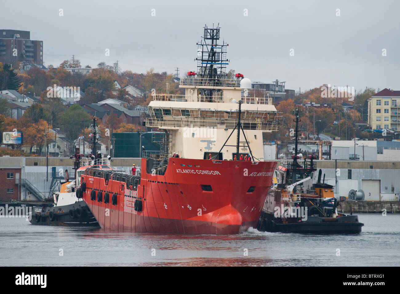 Tugs help the rig supplier Atlantic Condor to her fitting out berth at ...