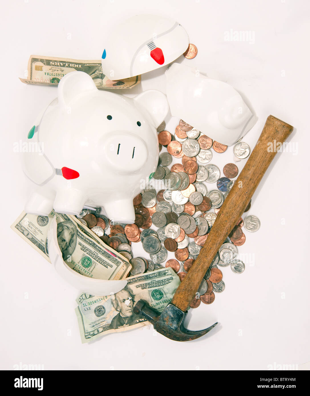 Broken Piggy Bank with coins flowing out Stock Photo - Alamy