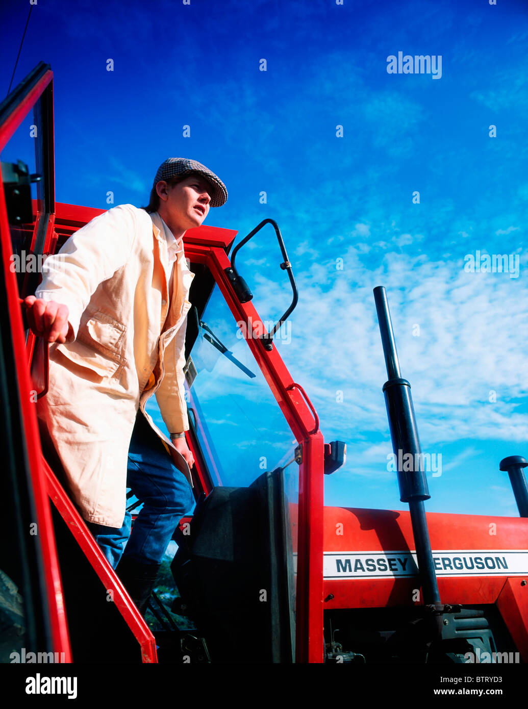 Farmer In A Tractor Stock Photo - Alamy