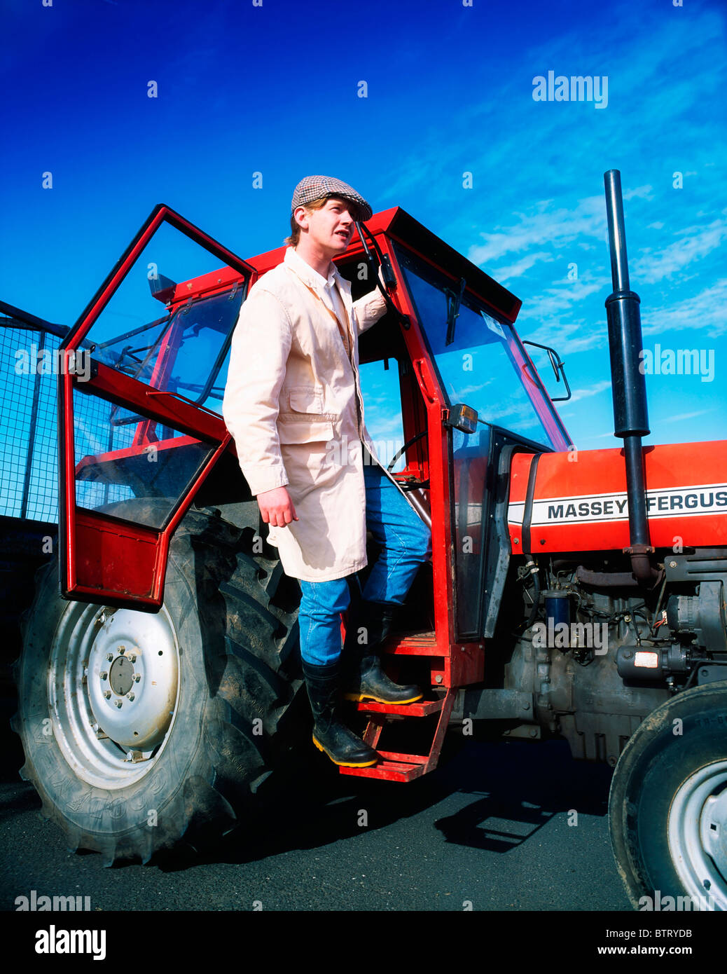 Farmer In A Tractor Stock Photo - Alamy
