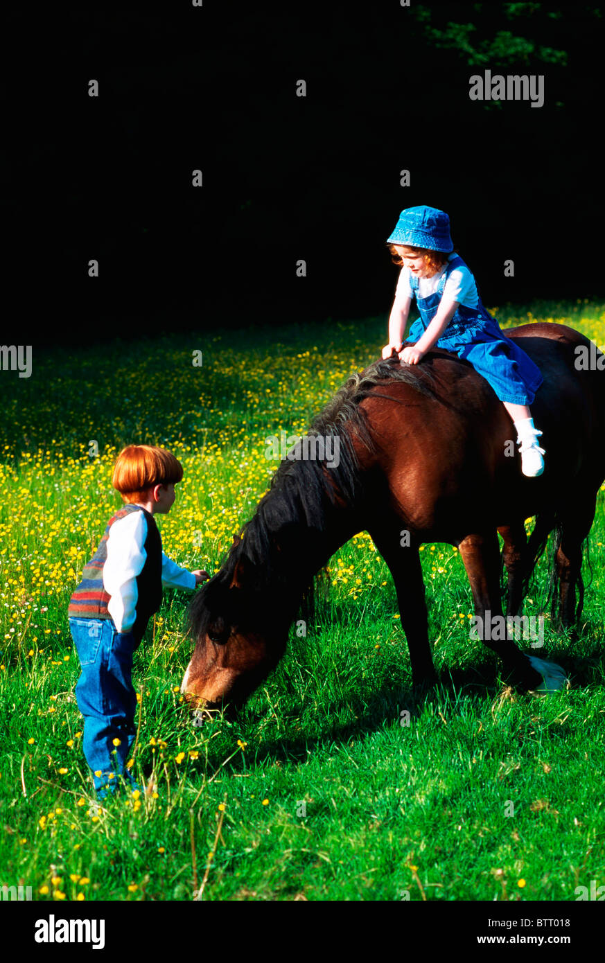 Children riding a horse hi-res stock photography and images - Alamy