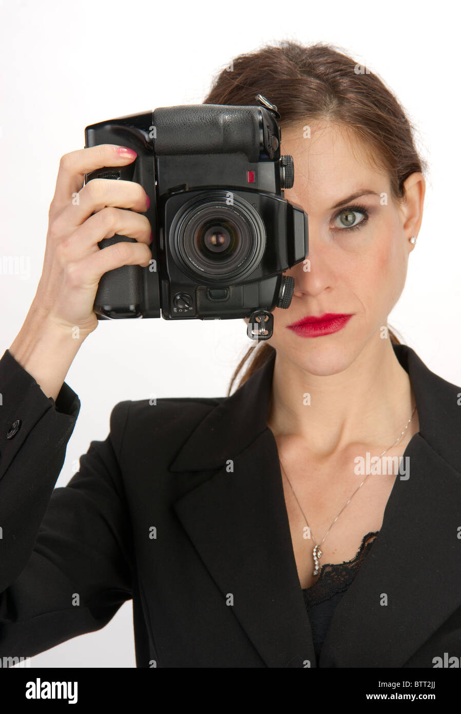 Adorable female pauses while taking a picture Stock Photo - Alamy