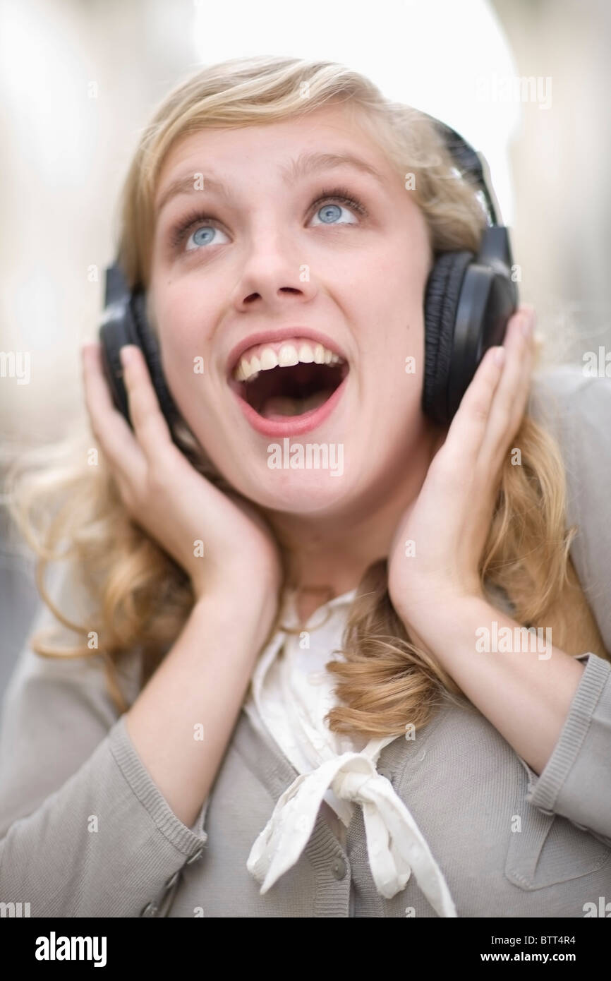 Young woman hearing music Stock Photo - Alamy