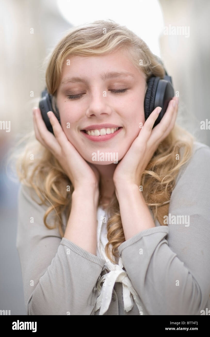 Young woman hearing music Stock Photo - Alamy