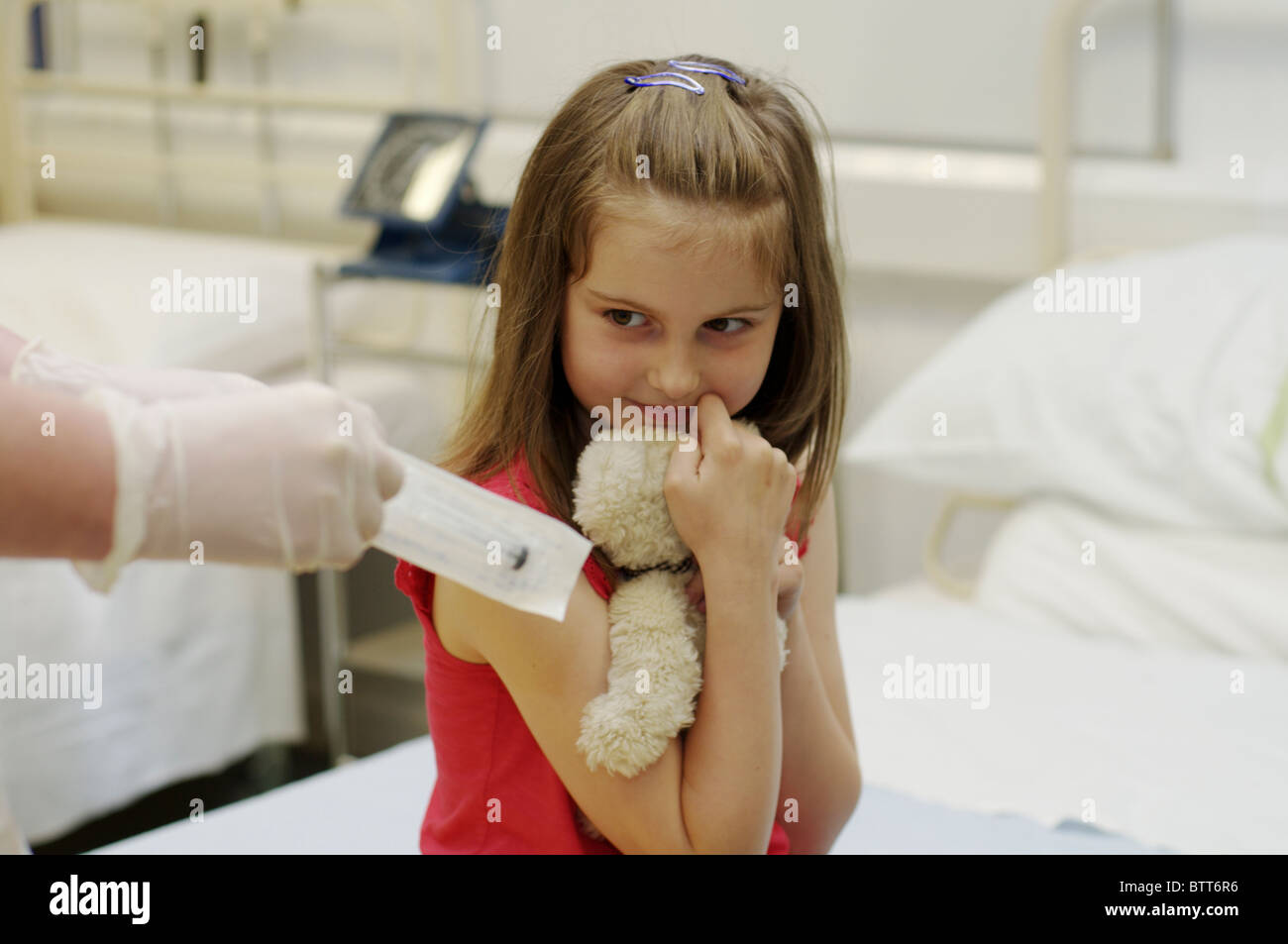 Young girl in hospital ward getting ready to have an injection Stock ...
