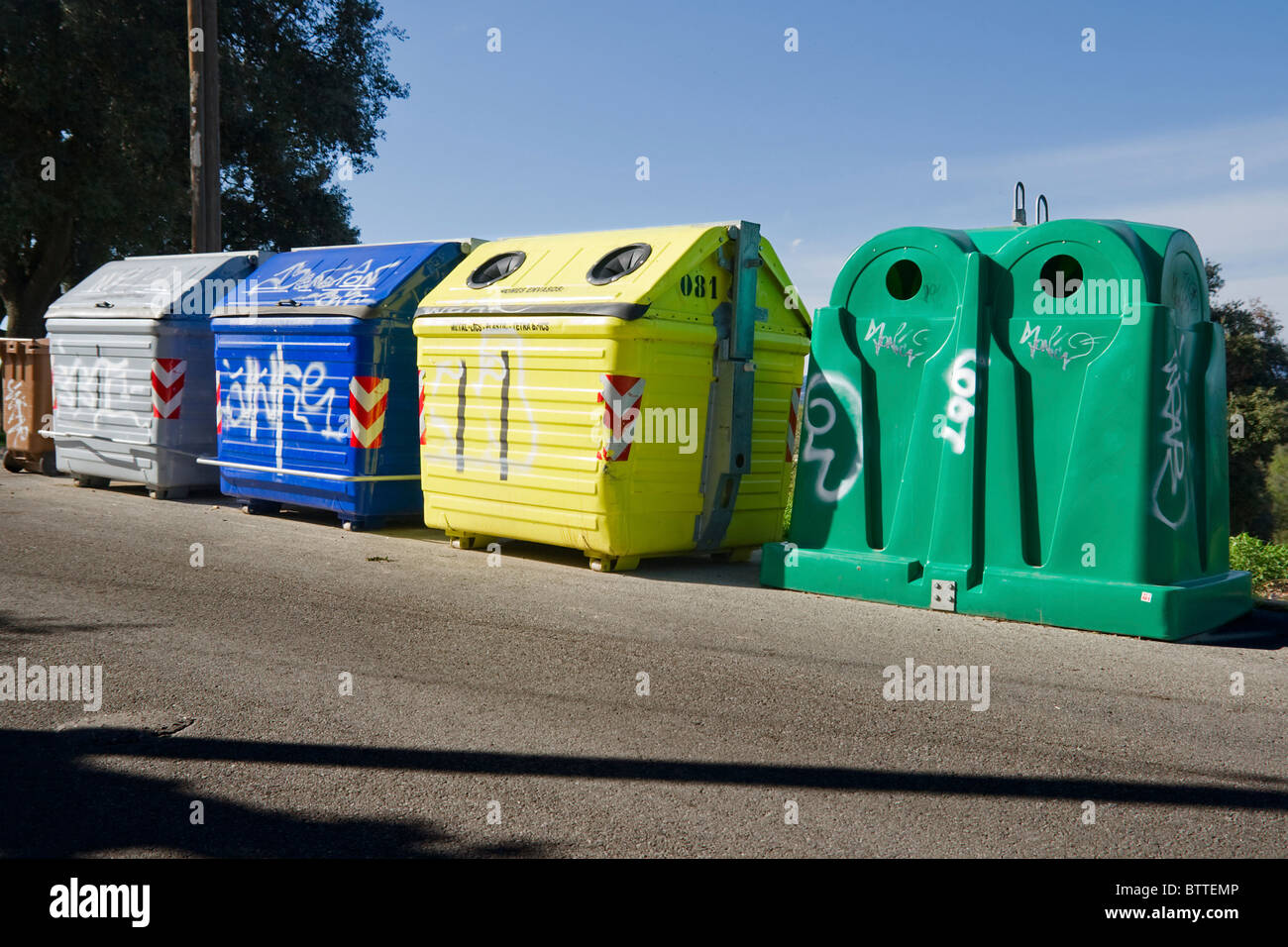 Full colored recycle garbage containers Stock Photo - Alamy