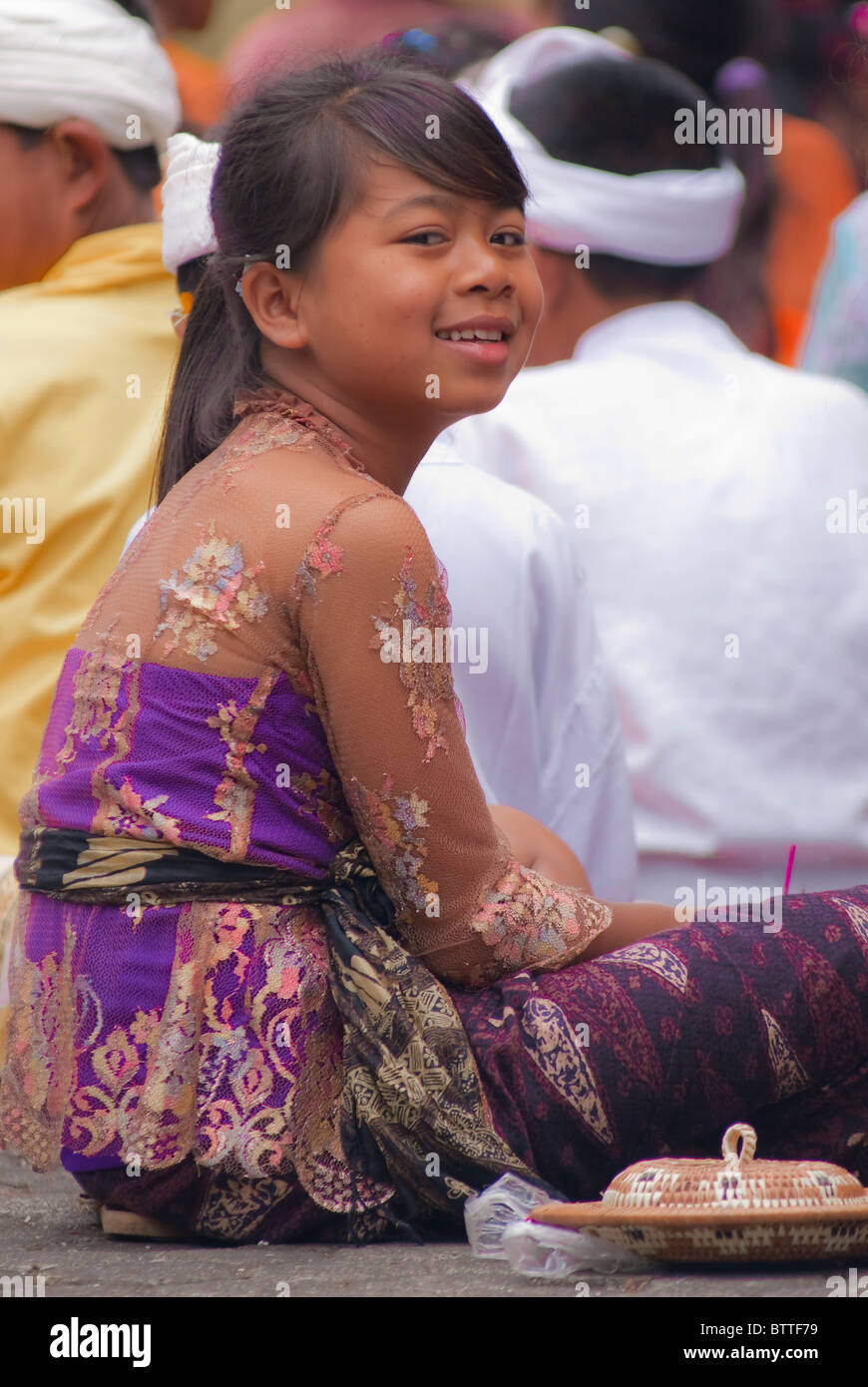 Young girl attending a ceremony in a temple near Ubud, Bali, Indonesia ...