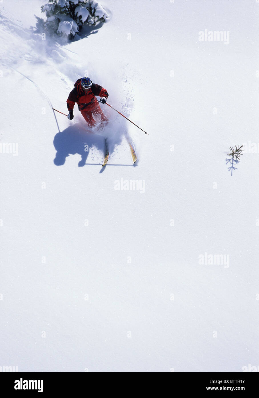 Ariel view of skier turning in fresh powder snow, Off piste, French ...