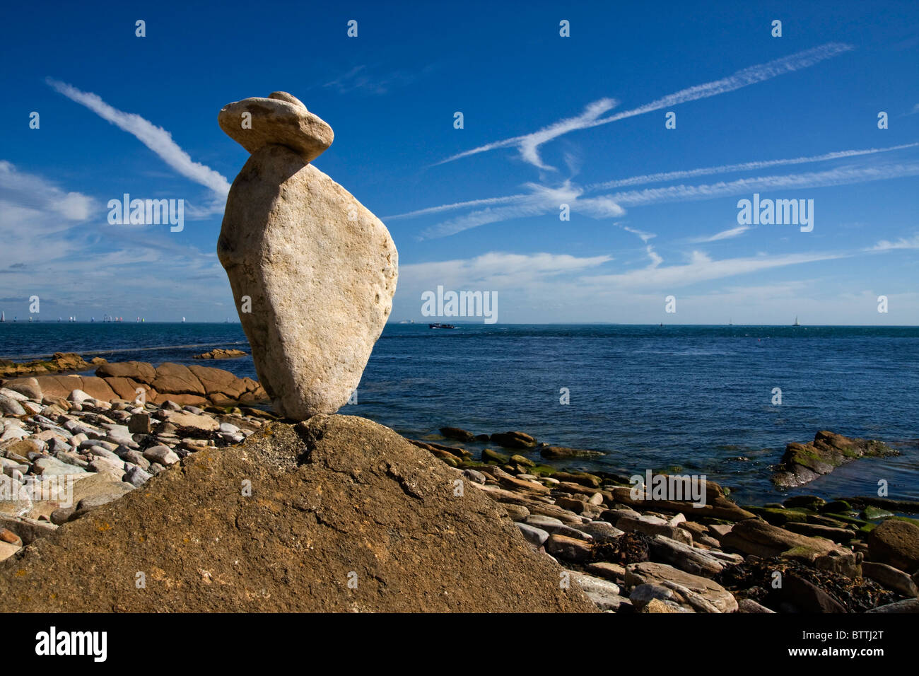 Standing Stone balancing on rock at Swanage, Dorset, UK Stock Photo - Alamy