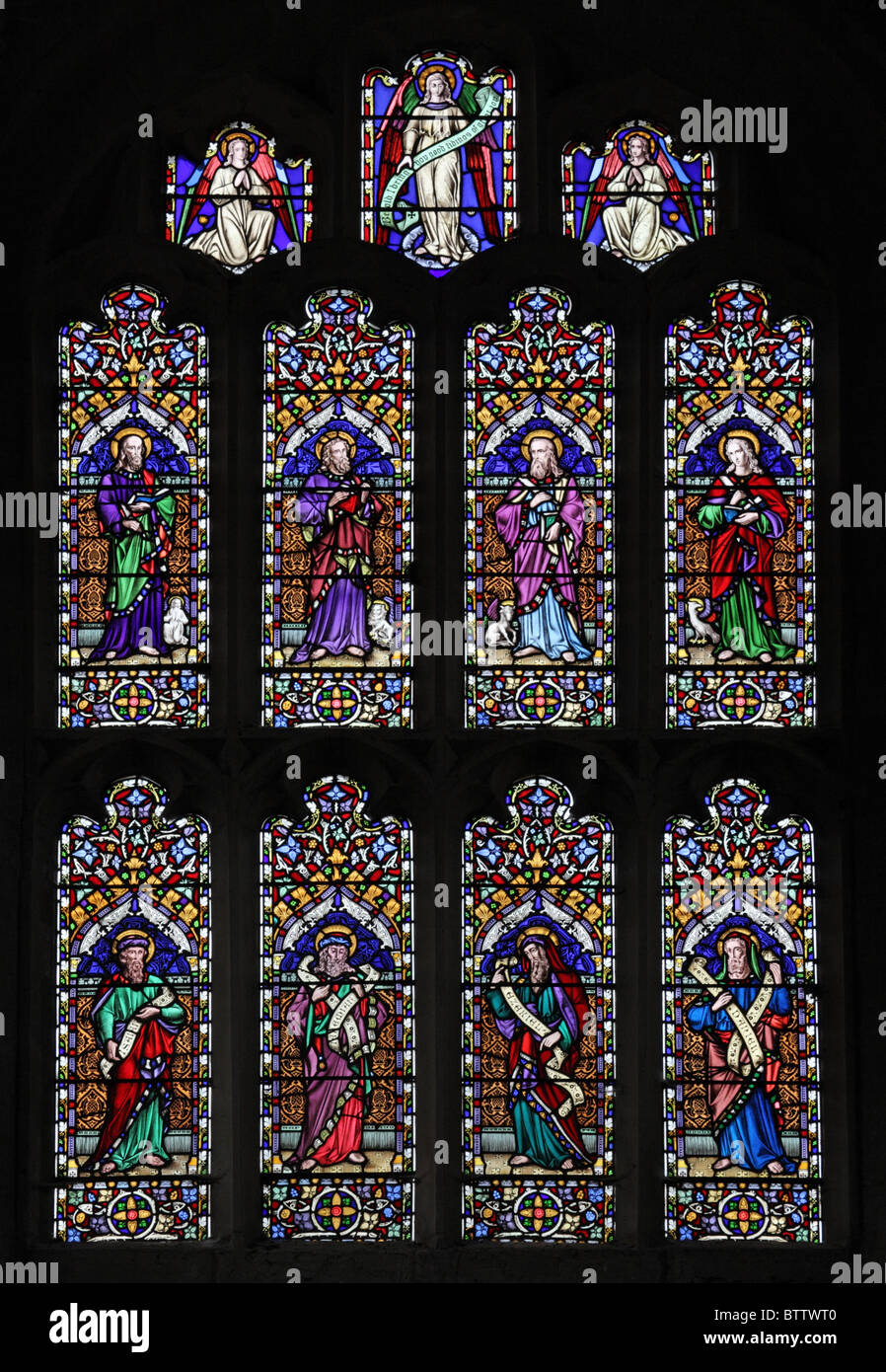 A stained glass window depicting the four evangelists and Old Testament ...