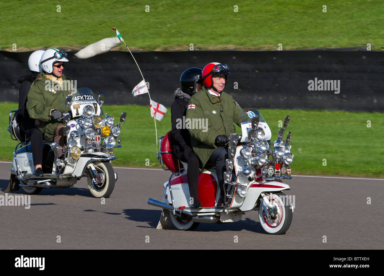 Mods on scooters take part in a display lap at the 2010 Goodwood ...