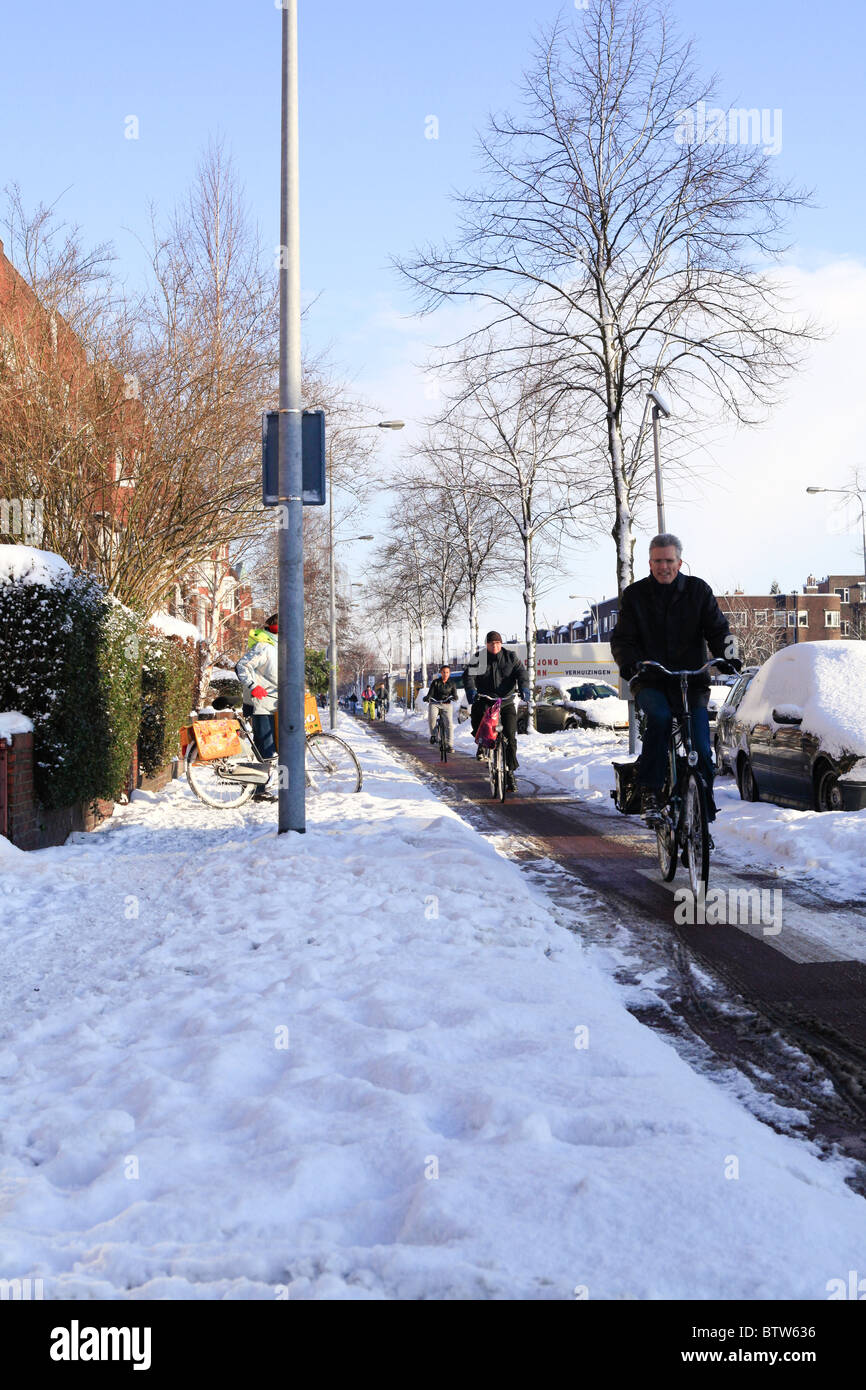 Man on bike iin winter Stock Photo - Alamy