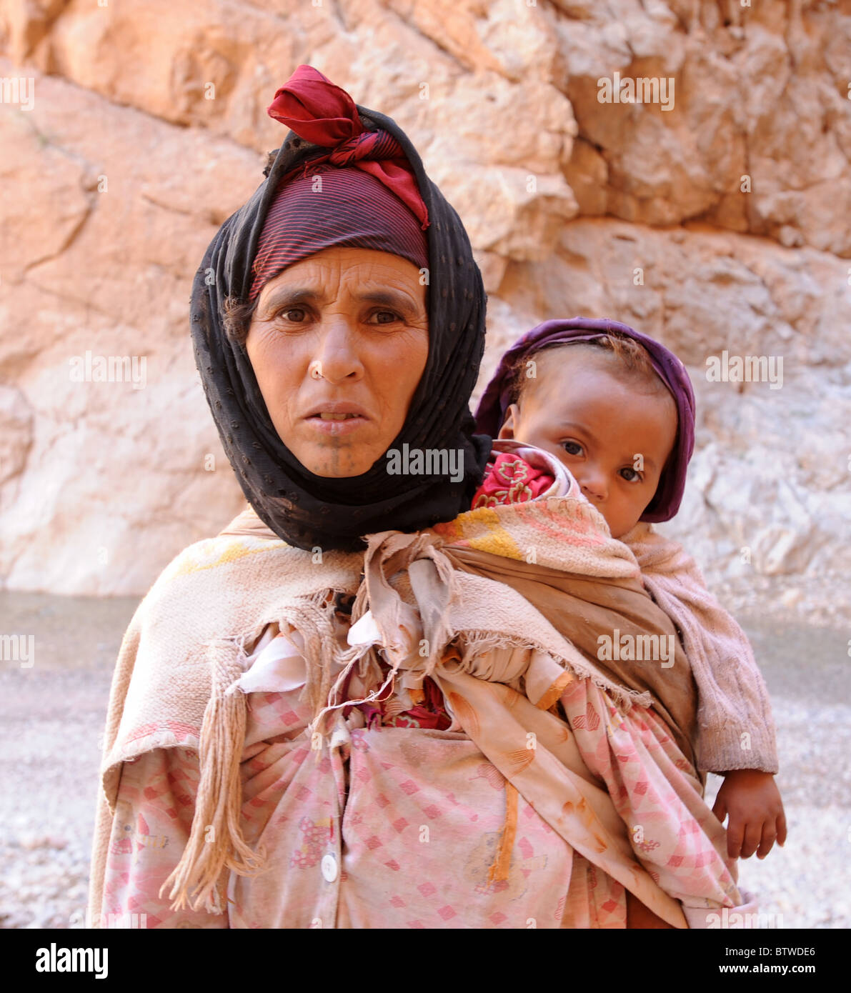 Happy dad carries serious podgy cute son Stock Photo - Alamy