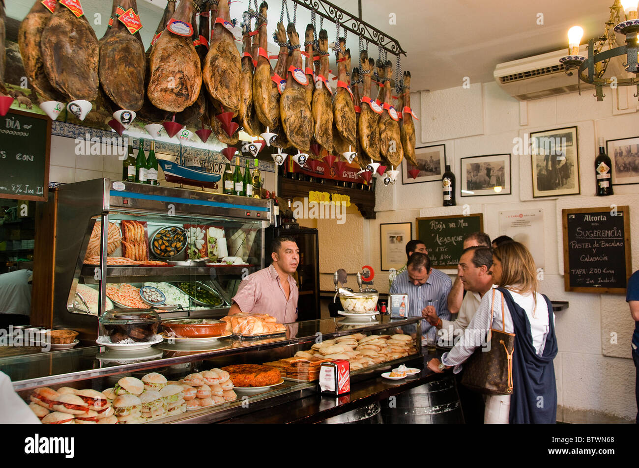 Seville Spain Gammon Jamon Iberico bar pub Stock Photo - Alamy