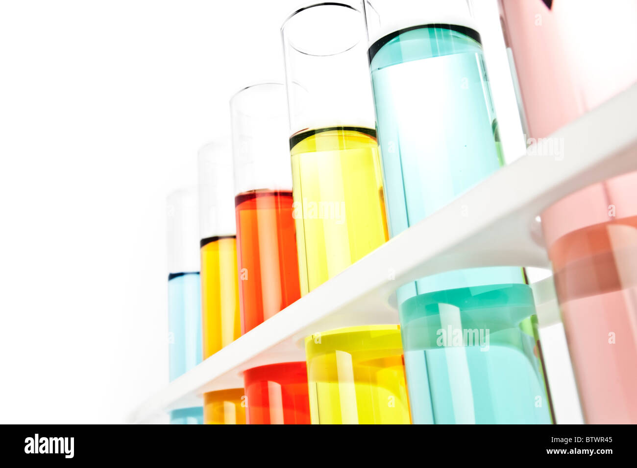 Row of test tubes filled with colored fluid Stock Photo - Alamy