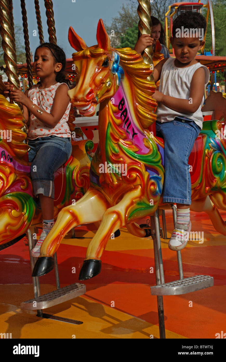 Go round wooden horses hi-res stock photography and images - Alamy