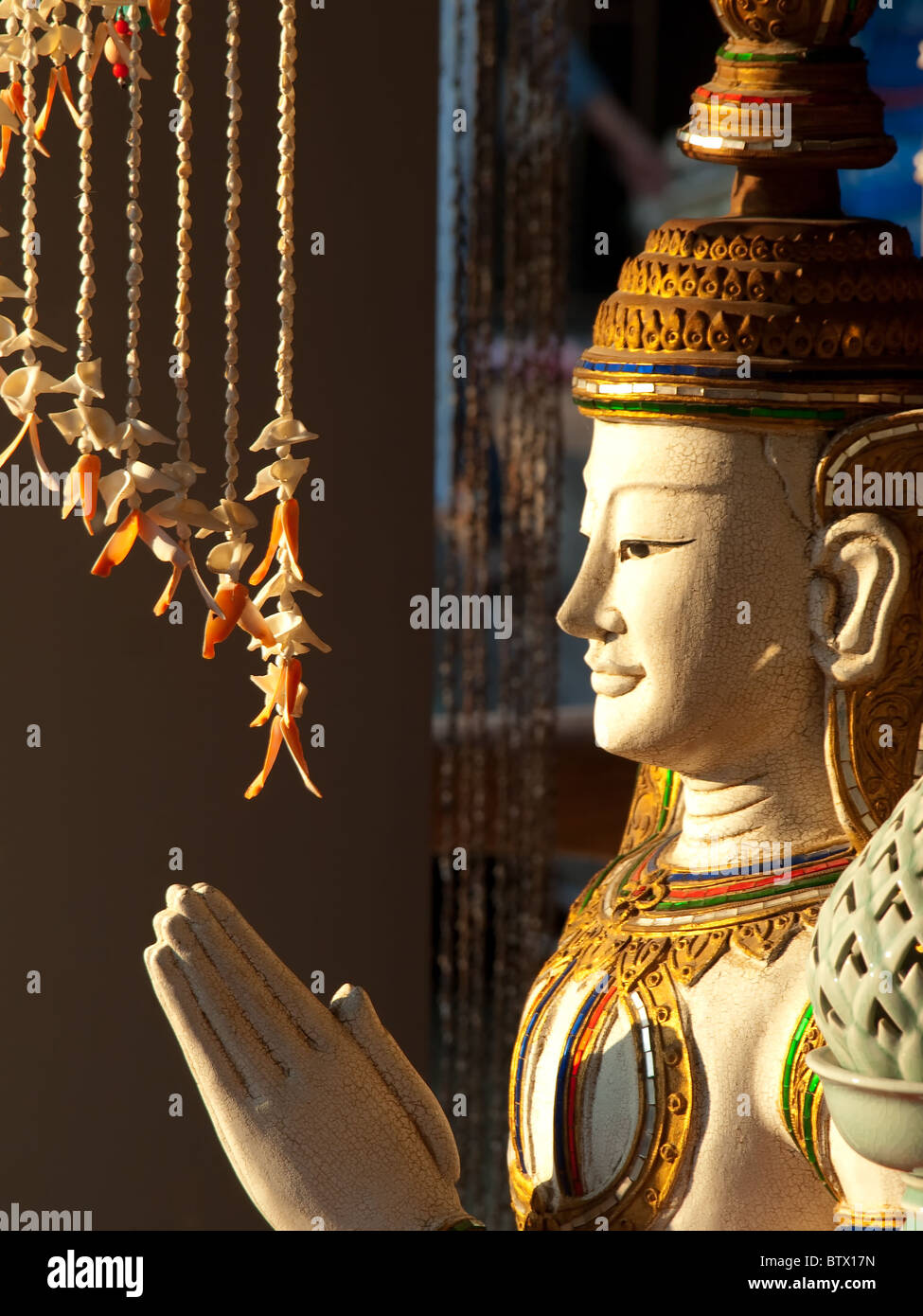 Buddha statue under the sunset light, focus on the face Stock Photo - Alamy