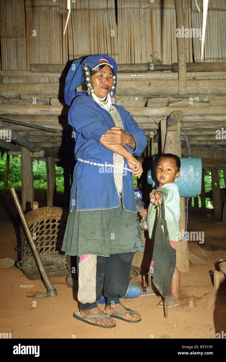Akha hill tribe woman in traditional dress and her son near Chang Mai ...