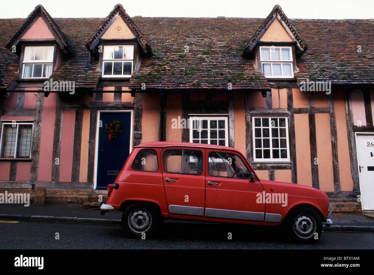 A French Made Red Renault 4 parked outside a Timber Framed building in ...