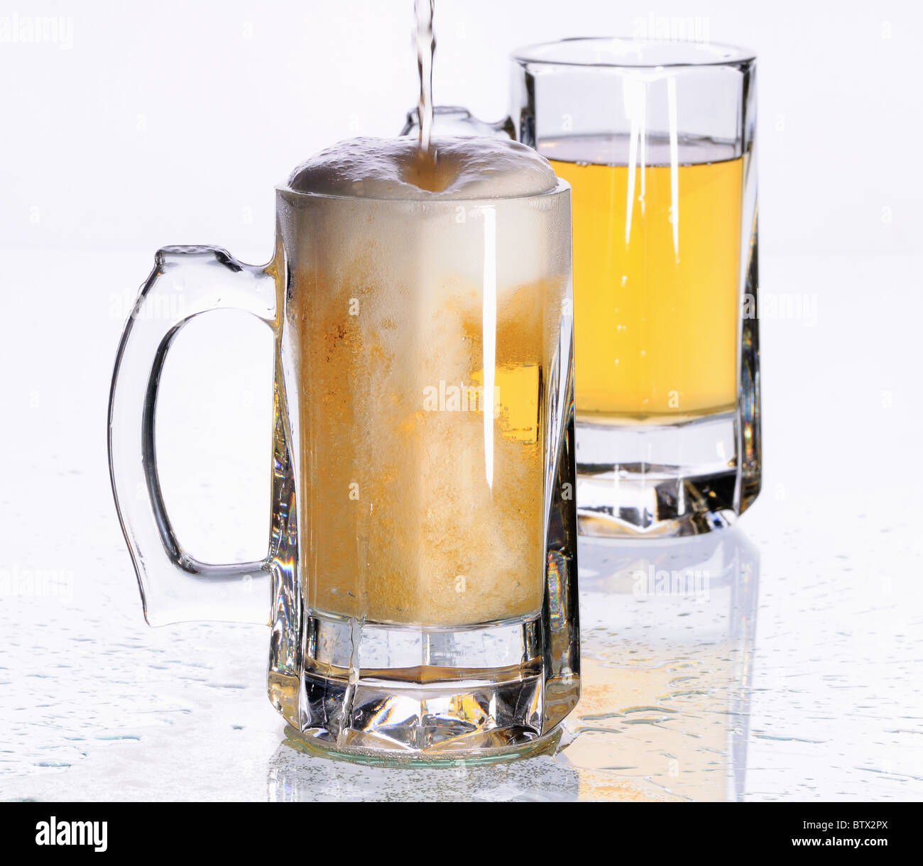 mugs with beer Stock Photo - Alamy