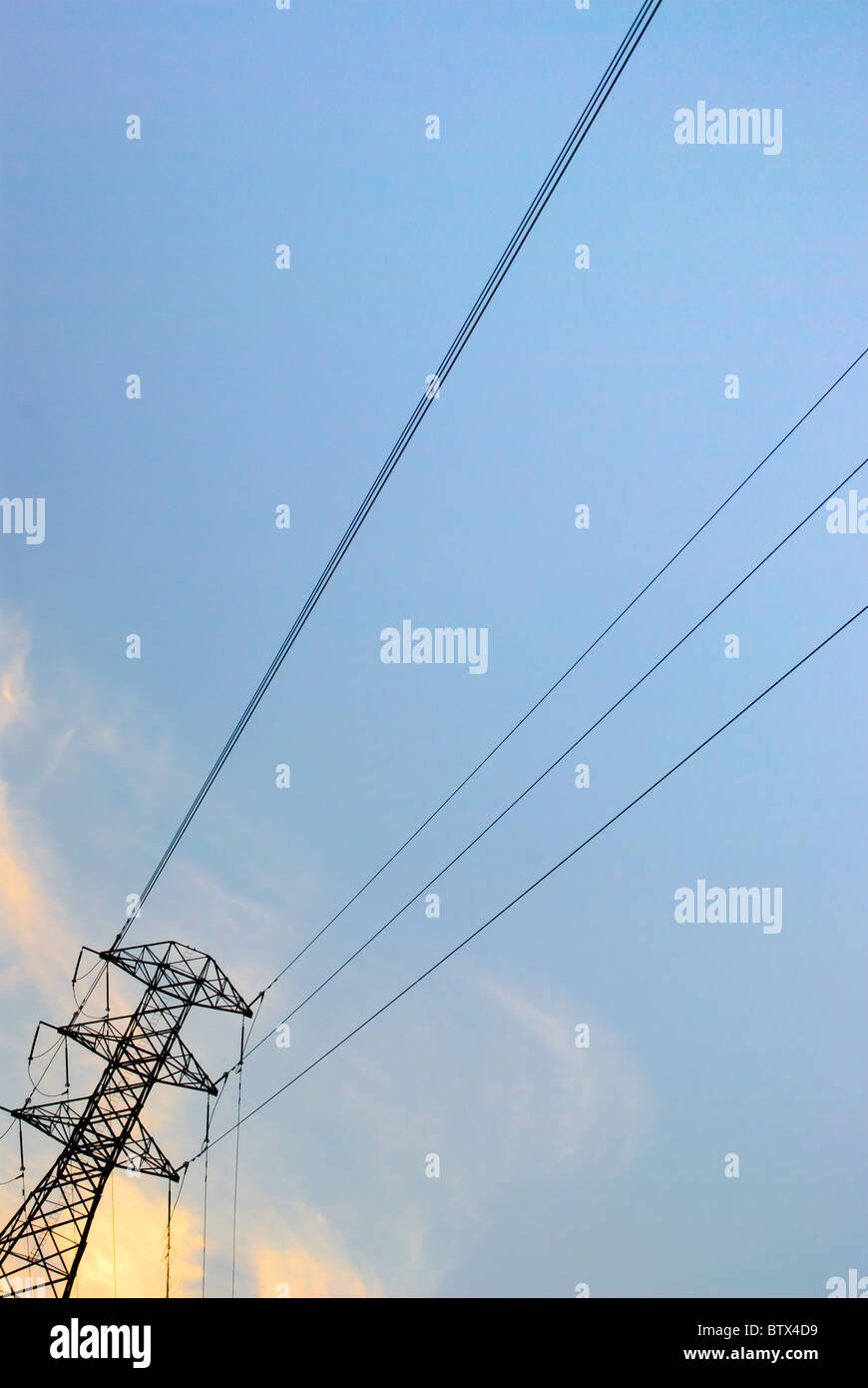 Overhead high tension power line and a tower Stock Photo - Alamy
