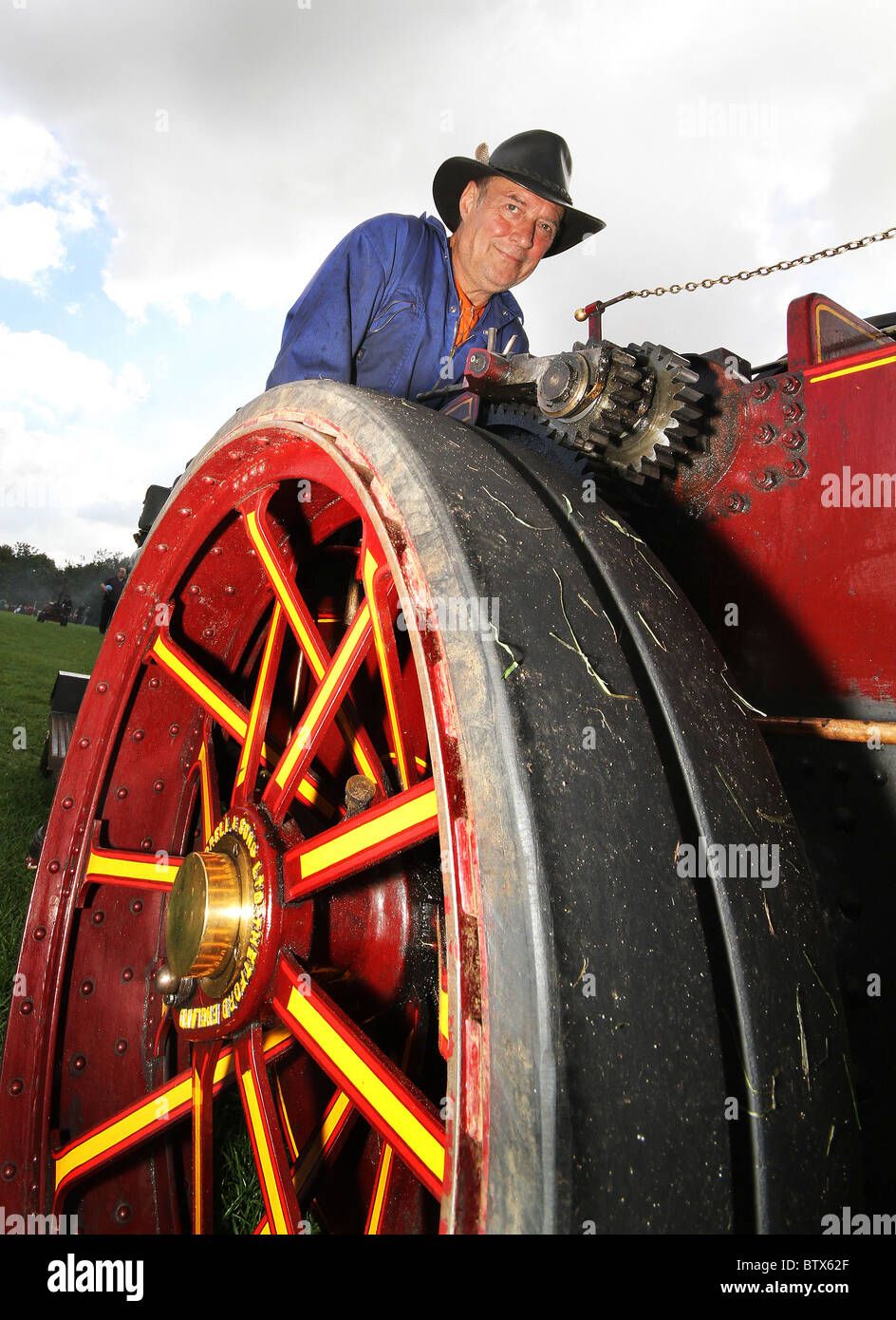 Low viewpoint of man on small scale model steam traction engine Stock ...
