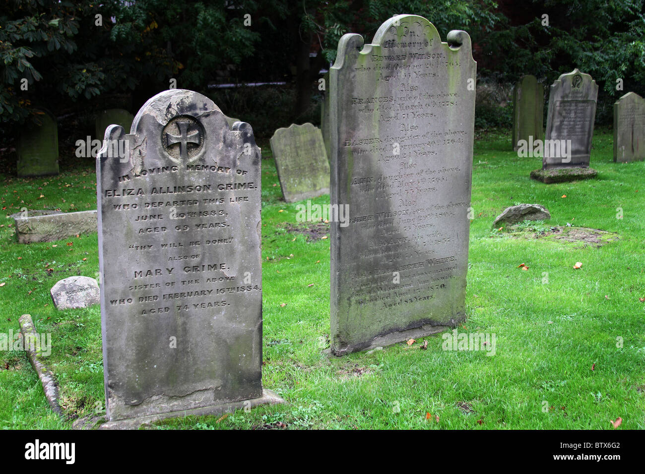 Old grave stones with inscriptions in the church yard in Hornsea, North ...