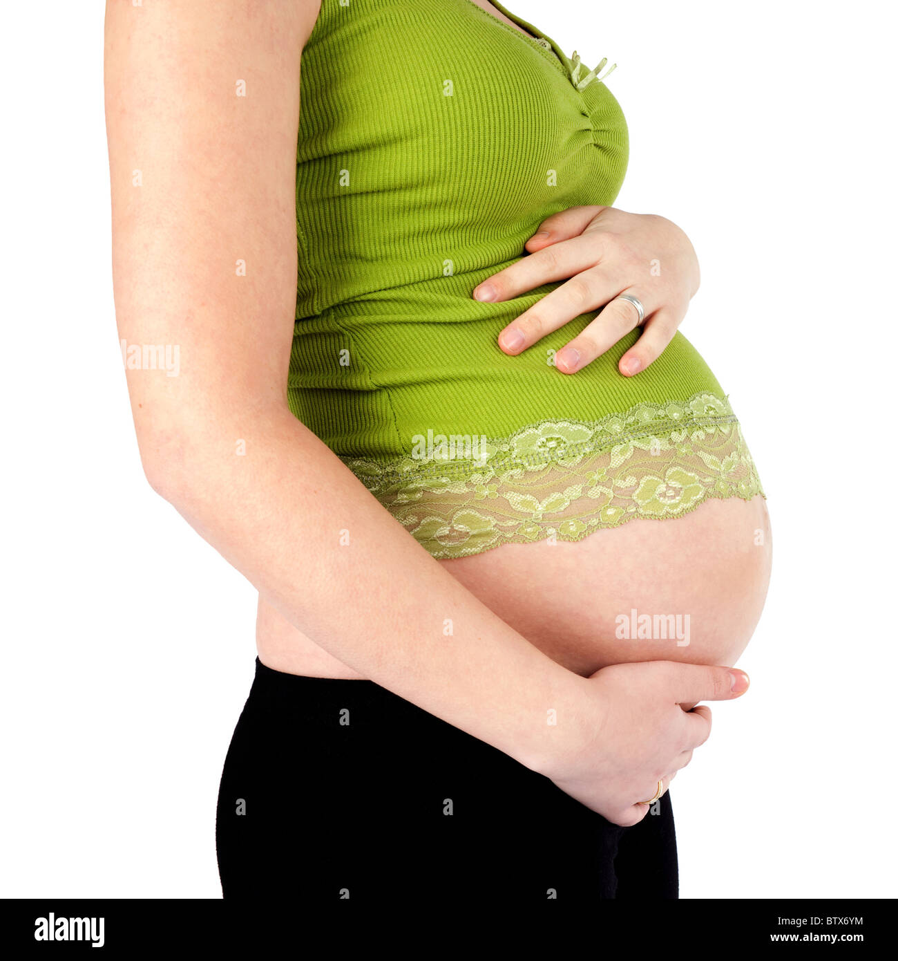 Nine Month Pregnant Woman Holding Belly Isolated Over White Background