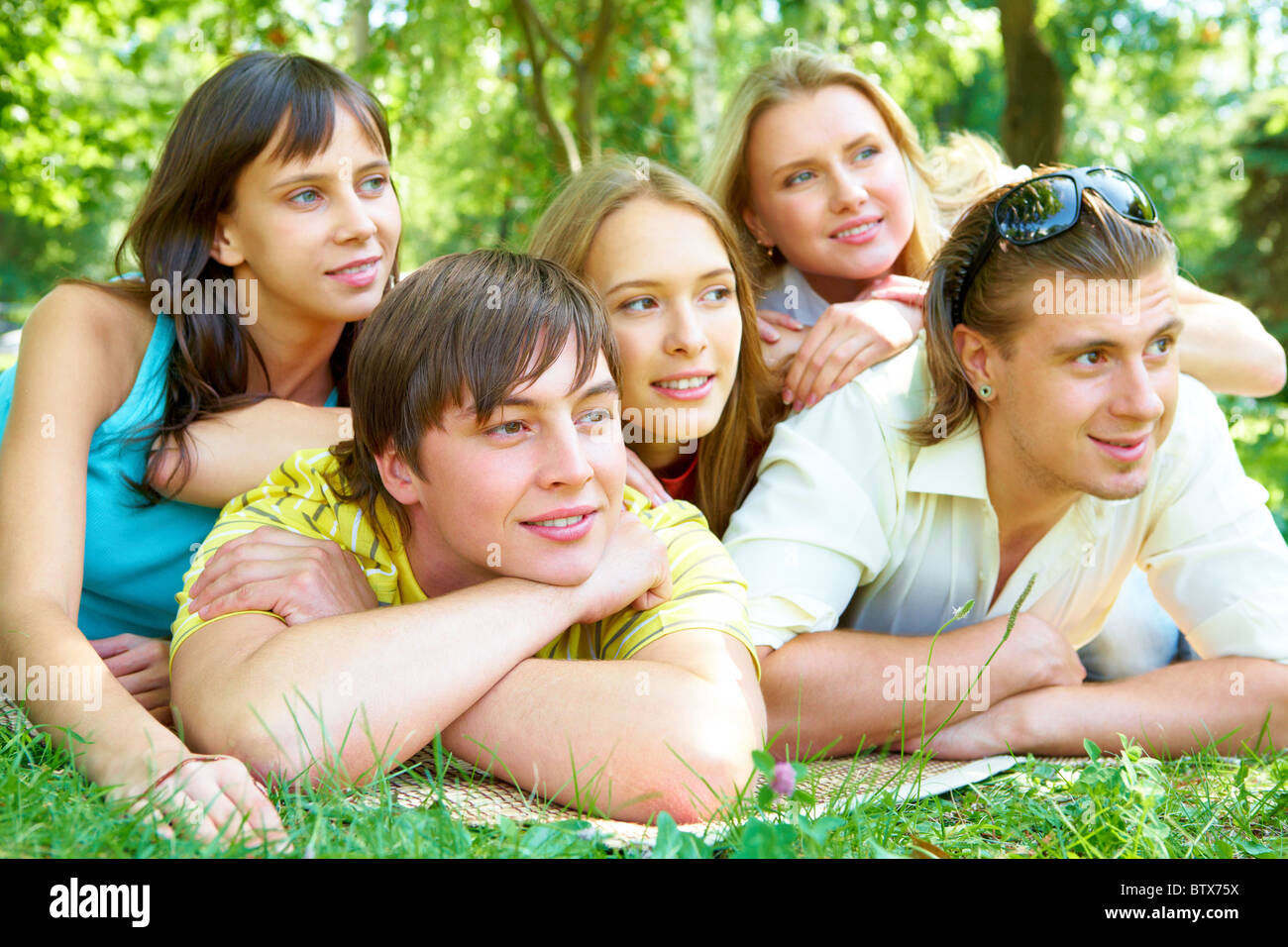 Photo of several happy friends relaxing outdoors Stock Photo - Alamy