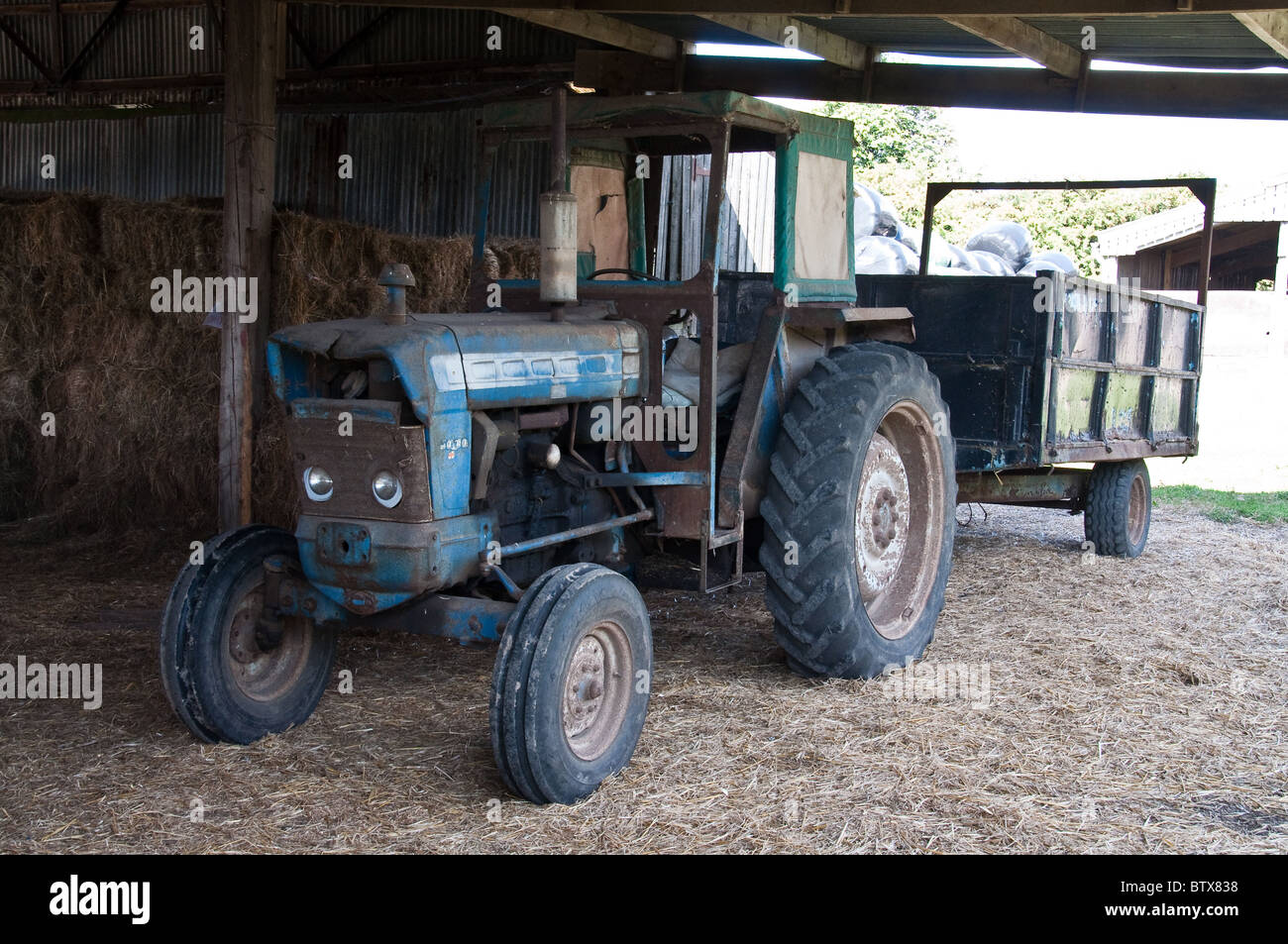 Old tractor in barn Stock Photo - Alamy