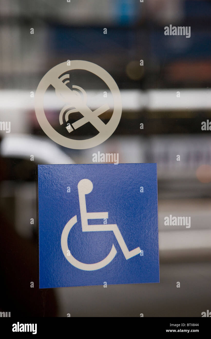 Disabled access sign on a window in New York Stock Photo - Alamy
