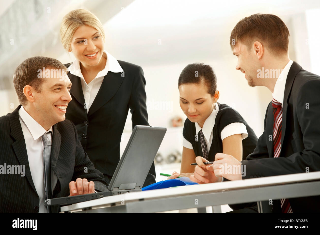 Portrait of interacting businessteam thinking about new project at ...