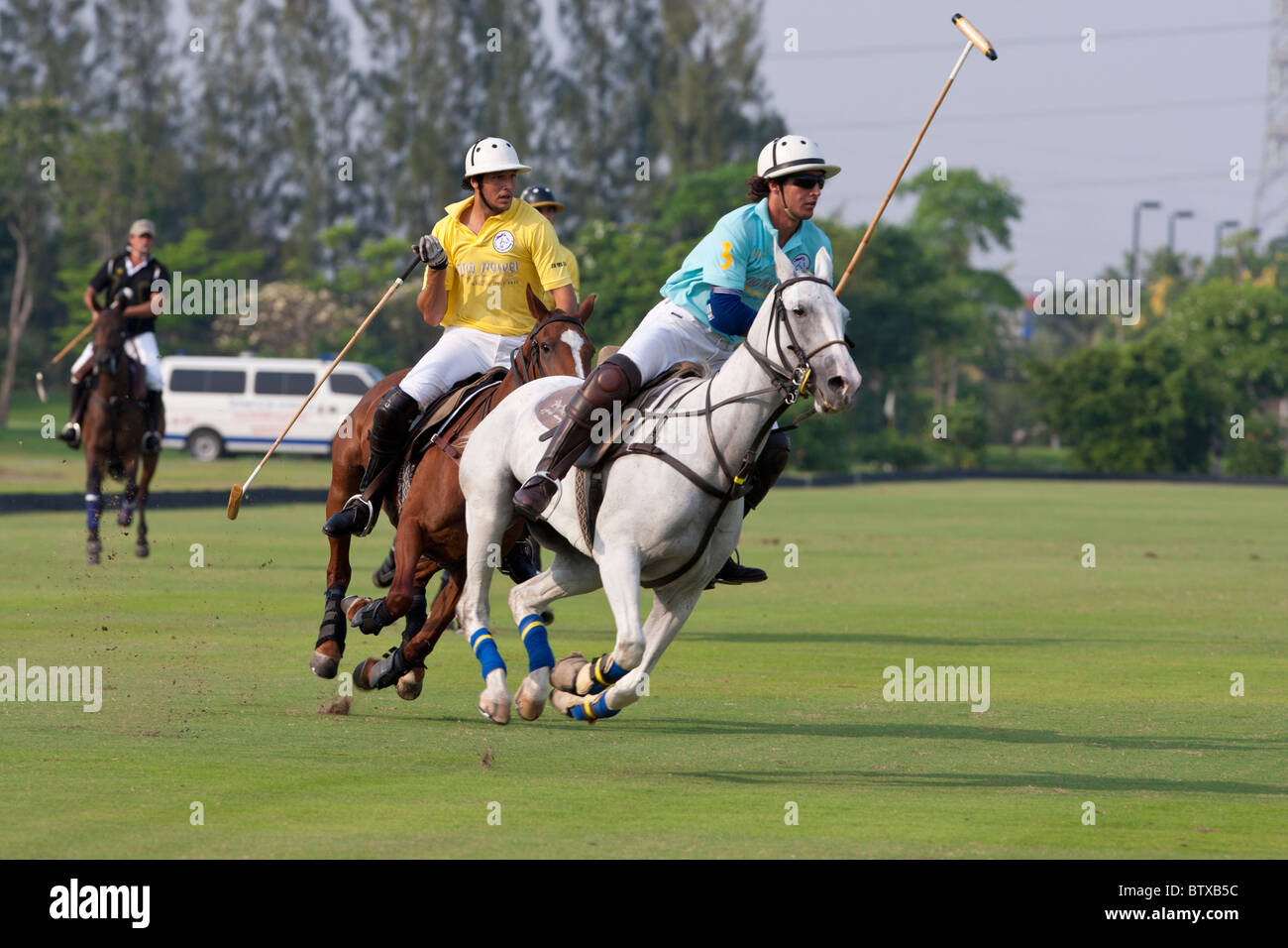 Two polo players in action Stock Photo - Alamy