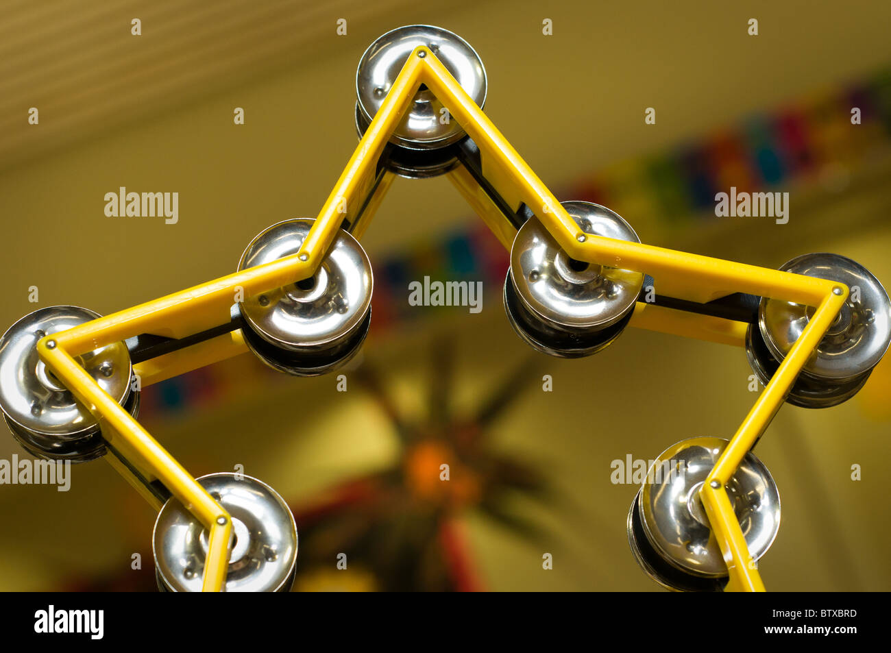 A star shaped tambourine Stock Photo - Alamy