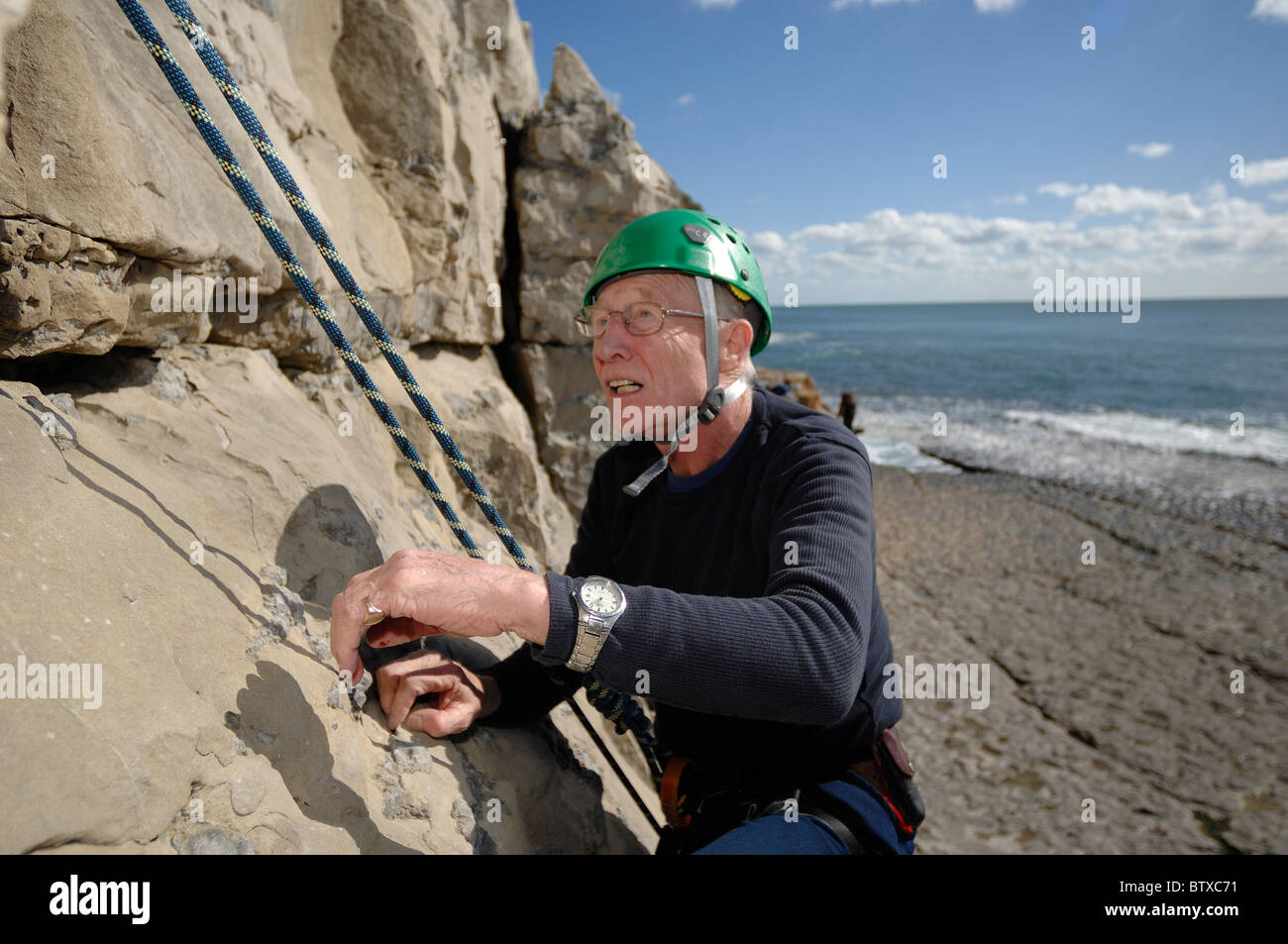 A 75 year old man learning to rock climb at Dancing Ledge Purbeck ...