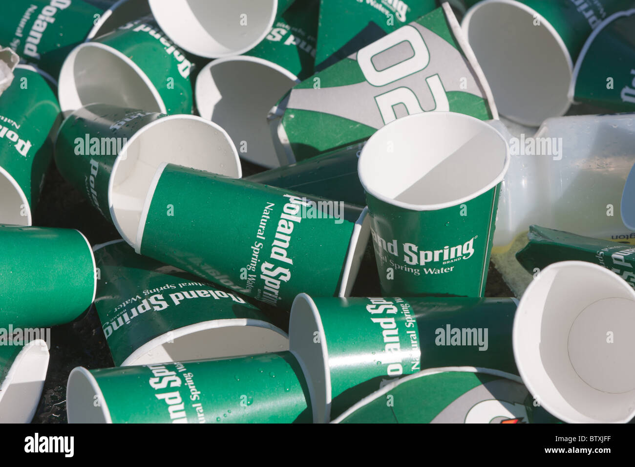 Used paper cups from from water and Gatorade on the street at a fluid ...